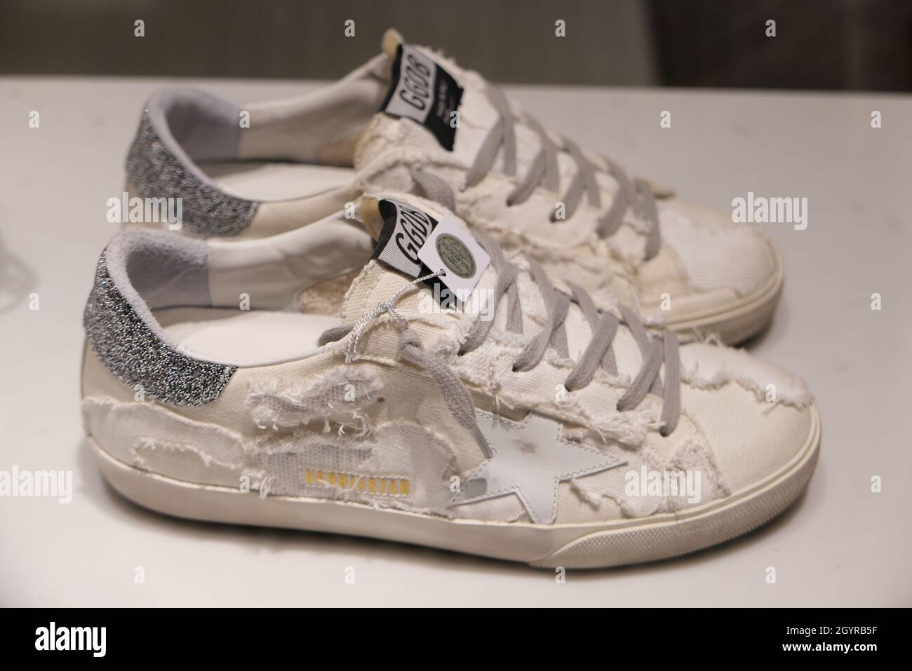 SHOES ON DISPLAY AT GOLDEN GOOSE FASHION STORE Stock Photo - Alamy