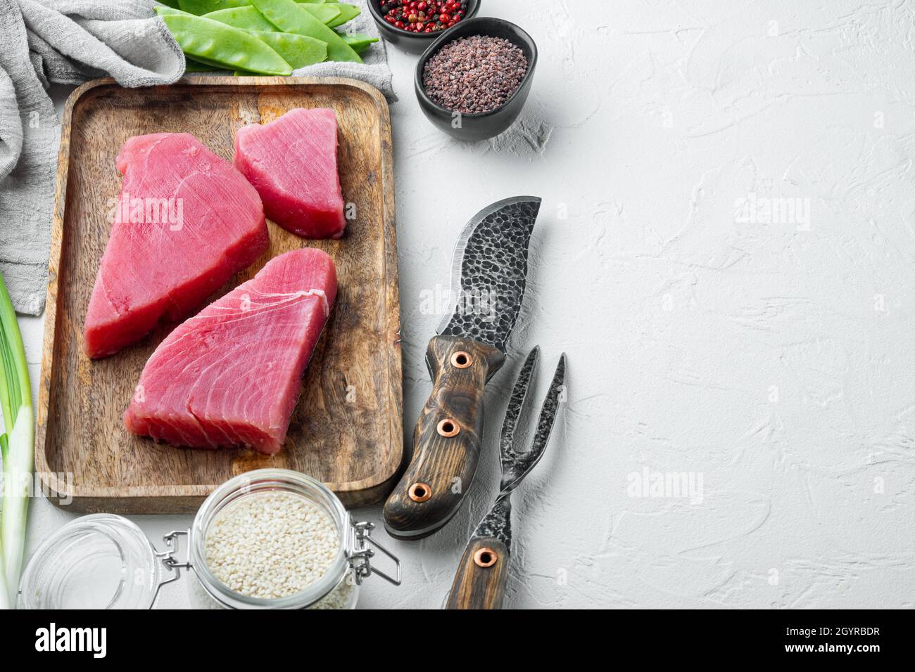 Raw tuna steak, fresh red tuna fillet with ingredients, green pea ...