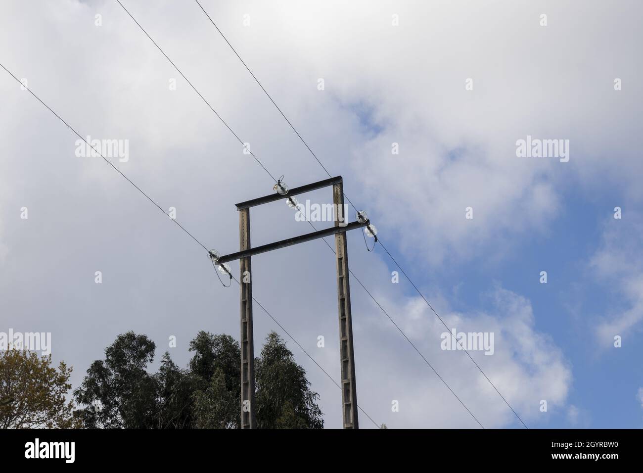 Single power line on the peaceful landscape below a cloudy sky Stock ...