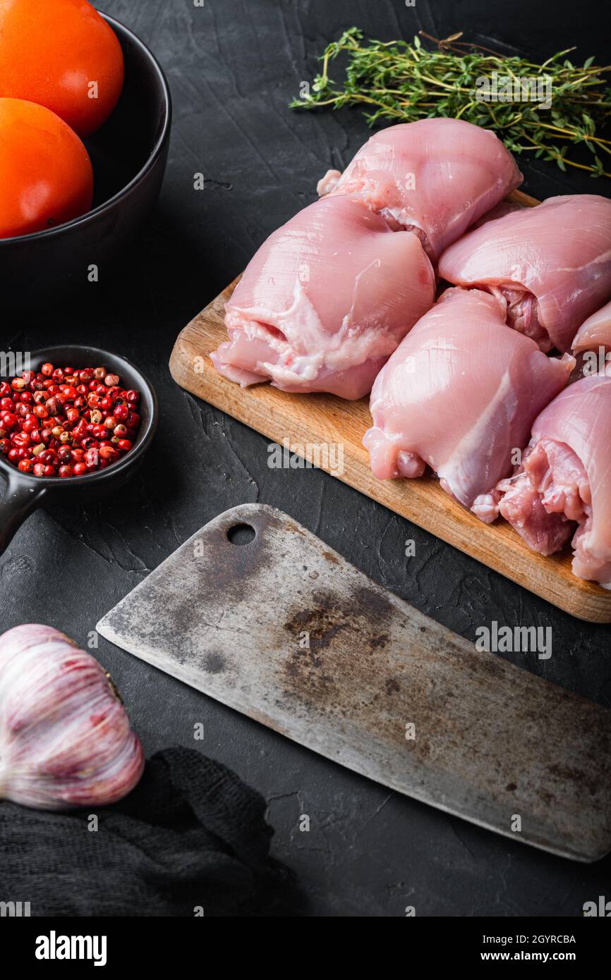 Doner ingredients, chicken thighs on black background Stock Photo - Alamy