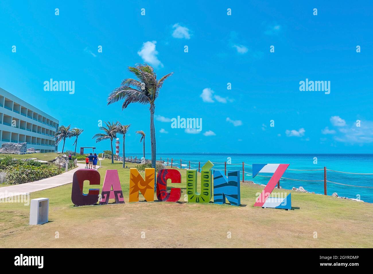 Cancun name sign at park against sea and sky Stock Photo - Alamy