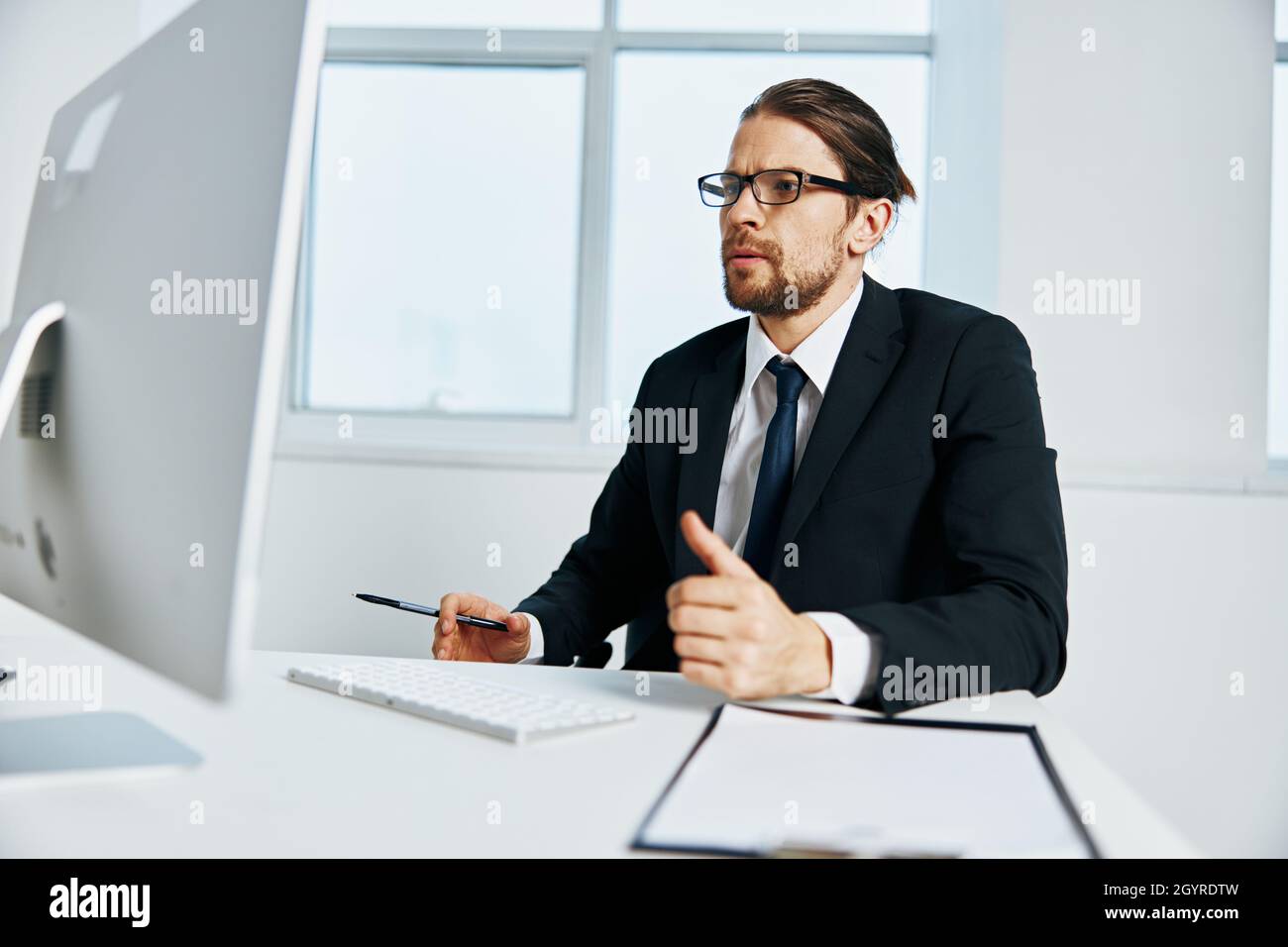 man in a suit an official is working at the computer Chief Stock Photo ...