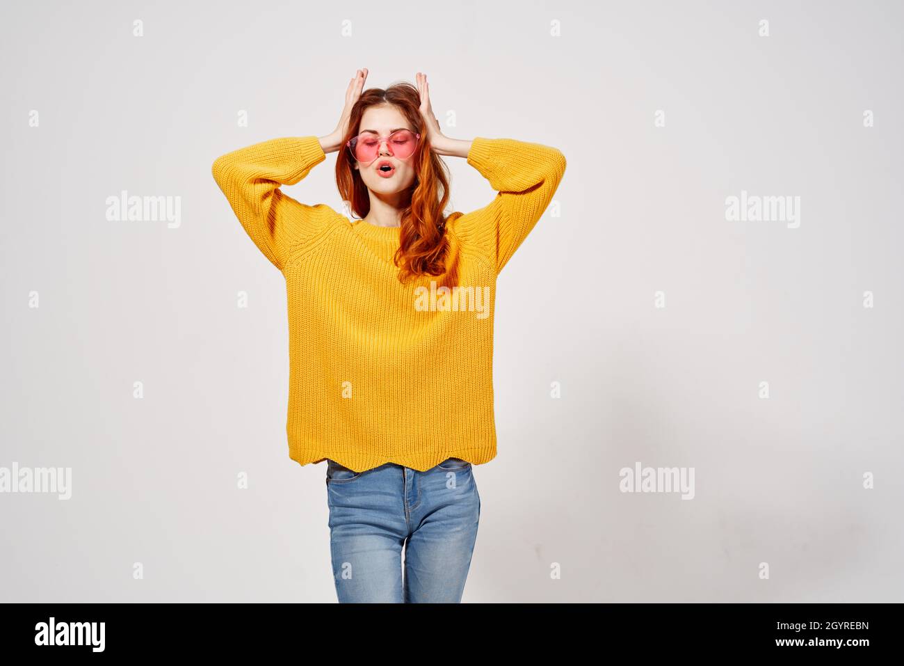 pretty woman in a yellow sweater hairstyle posing Studio fun model ...
