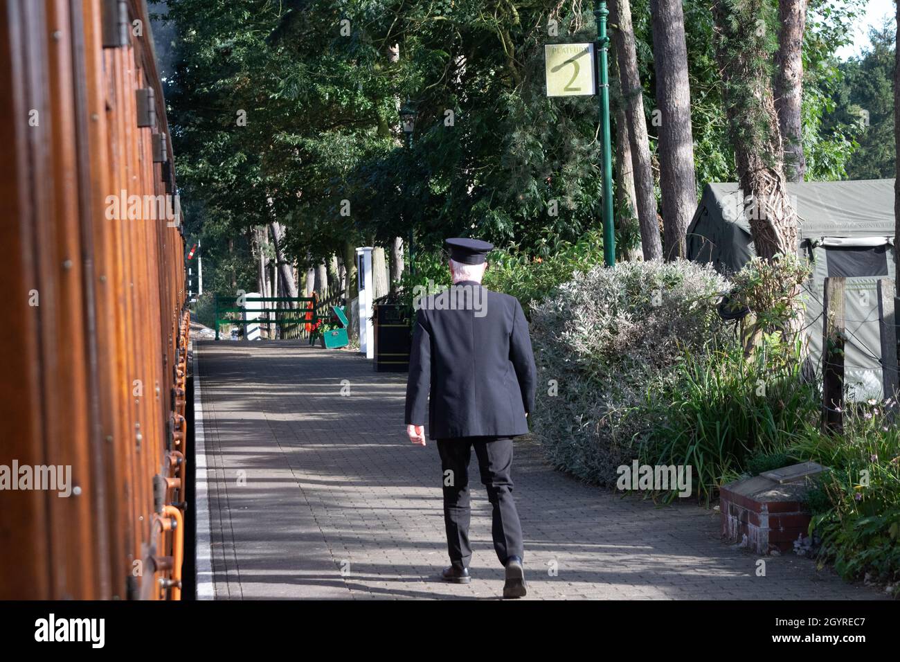 Sheringham, Norfolk, UK - SEPTEMBER 14 2019: Train conductor walks on ...