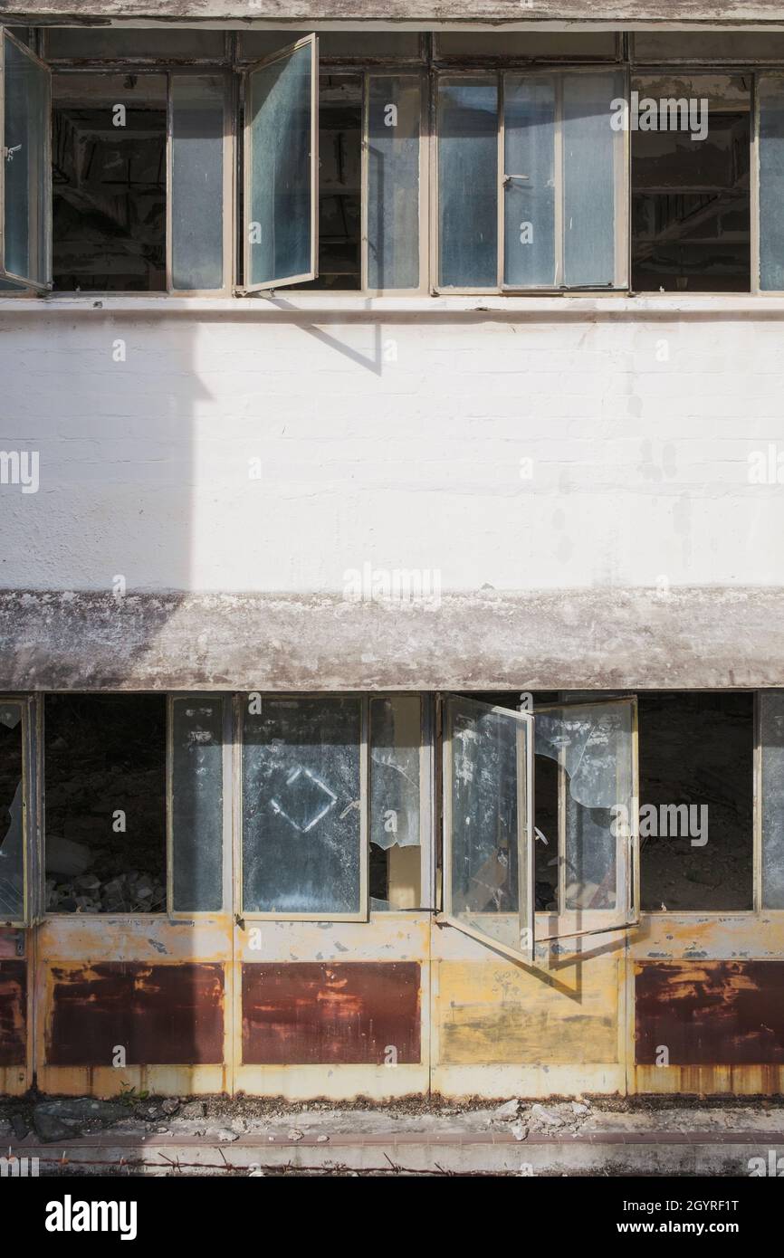 Broken windows, exterior of a abandoned school, nobody Stock Photo - Alamy