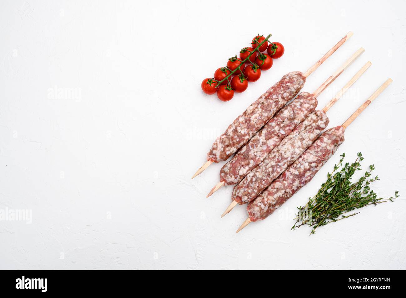 Raw Minced Lamb Shish Kebab kofta set, with grill ingredients, on white ...