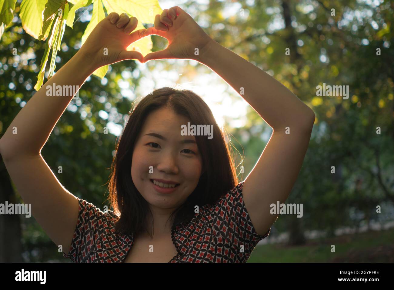 lifestyle portrait of young happy and beautiful Asian Korean woman ...