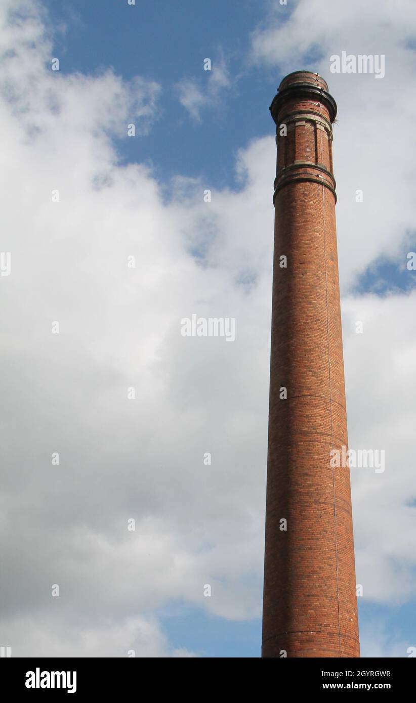 A Tall Traditional Red Brick Industrial Chimney Stock Photo - Alamy