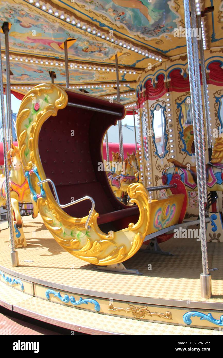 The Riding Carriage on a Fun Fair Carousel Ride Stock Photo - Alamy