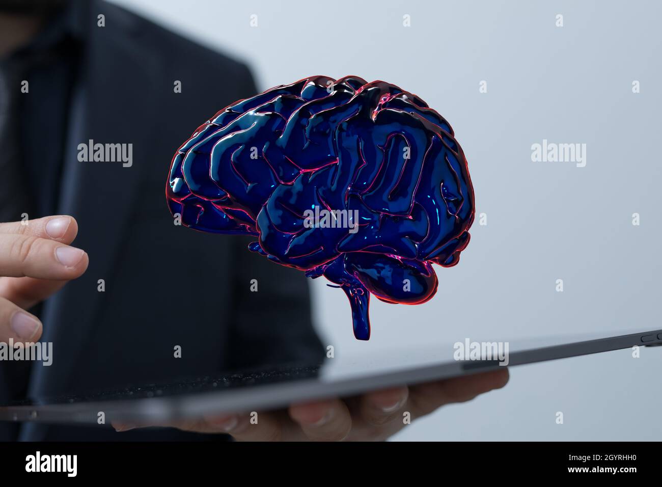 3d illustration of a human brain floating near a hand and tablet Stock ...