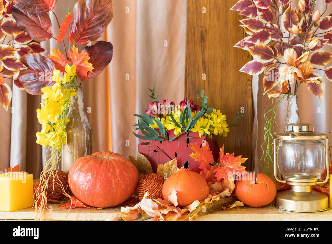 Autumn composition. Pumpkins, candles and dried flowers. Autumn ...