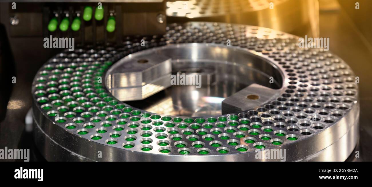 green capsule medicine pill in the production line of medicine filling ...