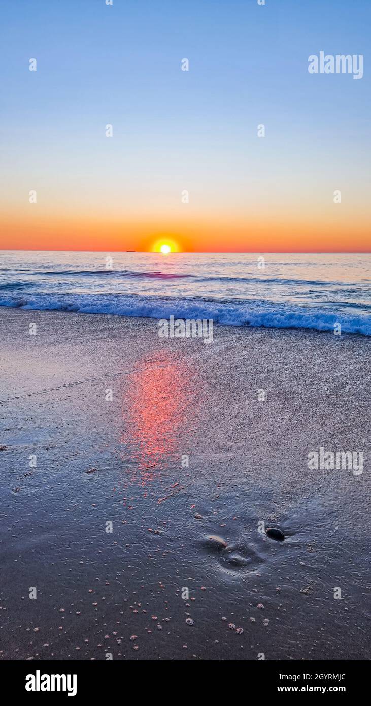 Beach at the sunset Stock Photo - Alamy