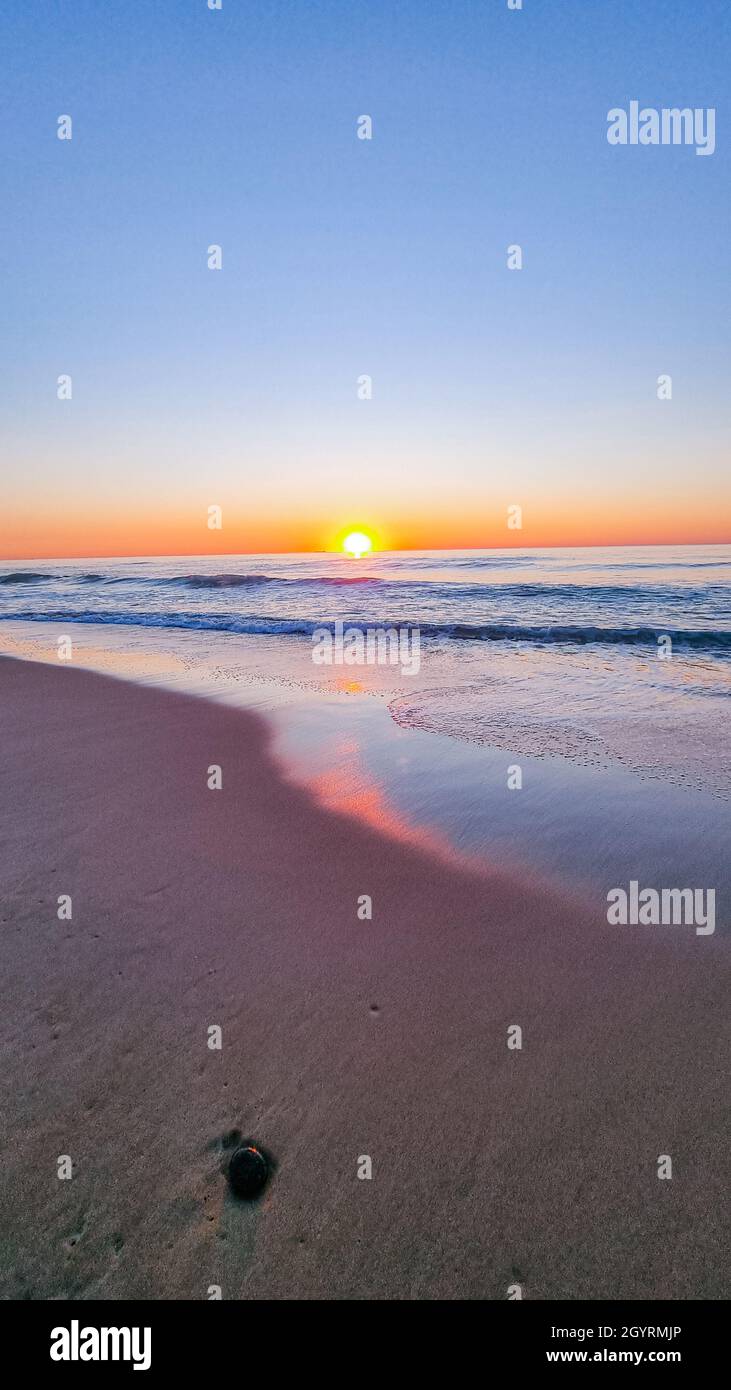 Beach at the sunset Stock Photo - Alamy