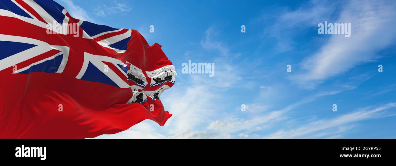 flag of Trinity House Ensign at cloudy sky background on sunset ...