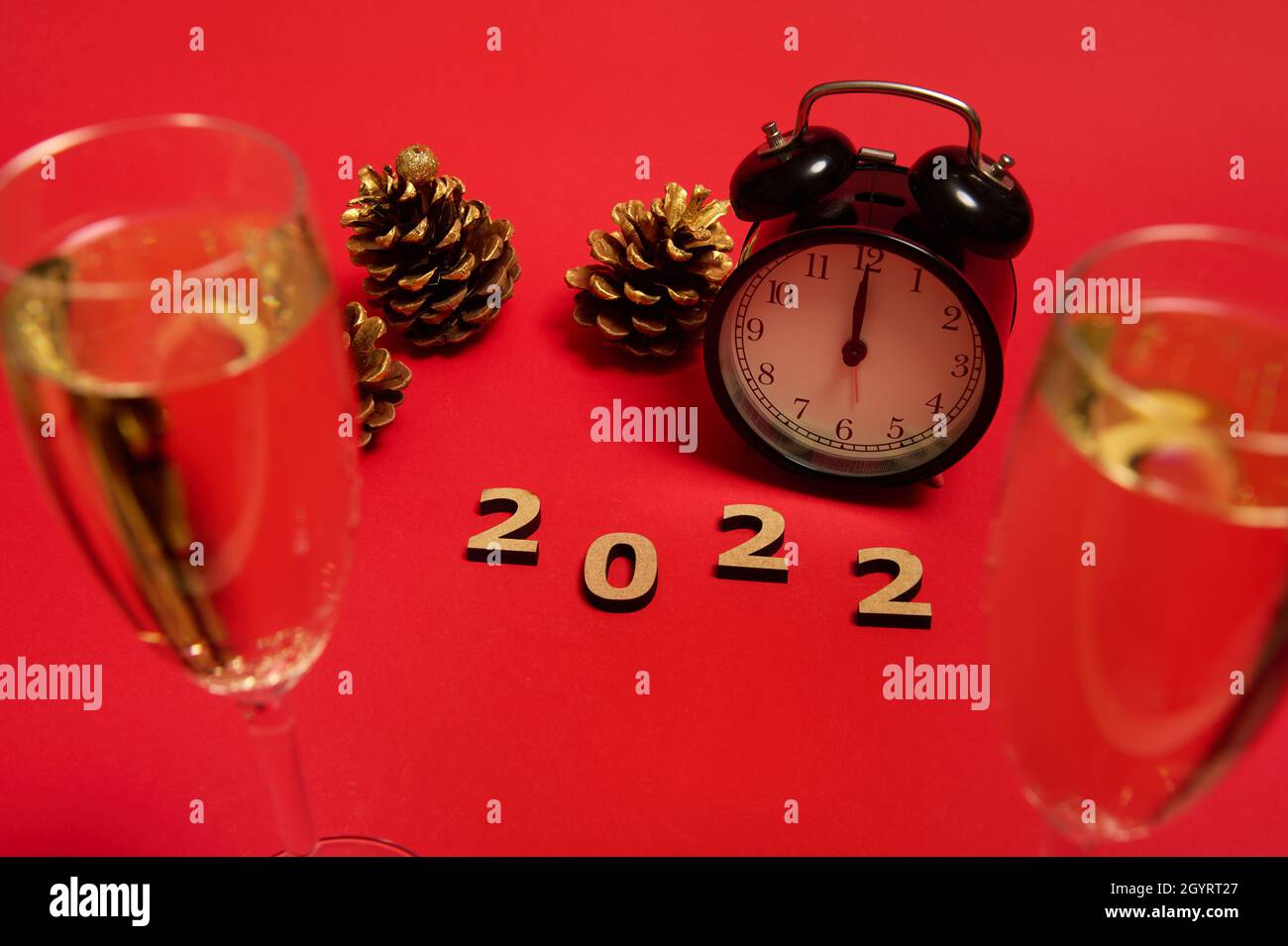 Composition with wooden numerals, 2022 year, black alarm clock with ...