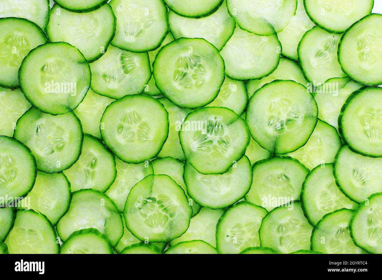 Fresh cucumber slices close-up background Stock Photo - Alamy