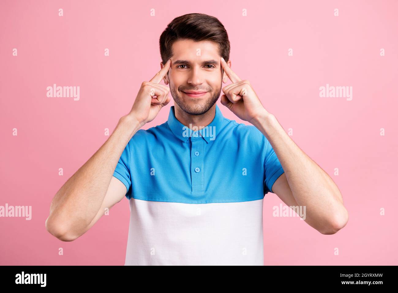 Portrait of young peaceful positive guy touch temple forehead remember ...