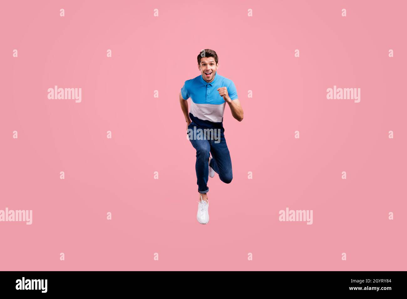 Full body photo of funky brunet young guy run wear polo jeans sneakers ...