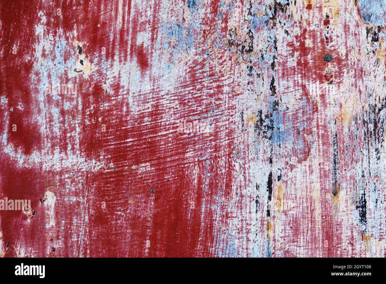 Old corroded metal sheet with worn out red peeling paint, grunge ...