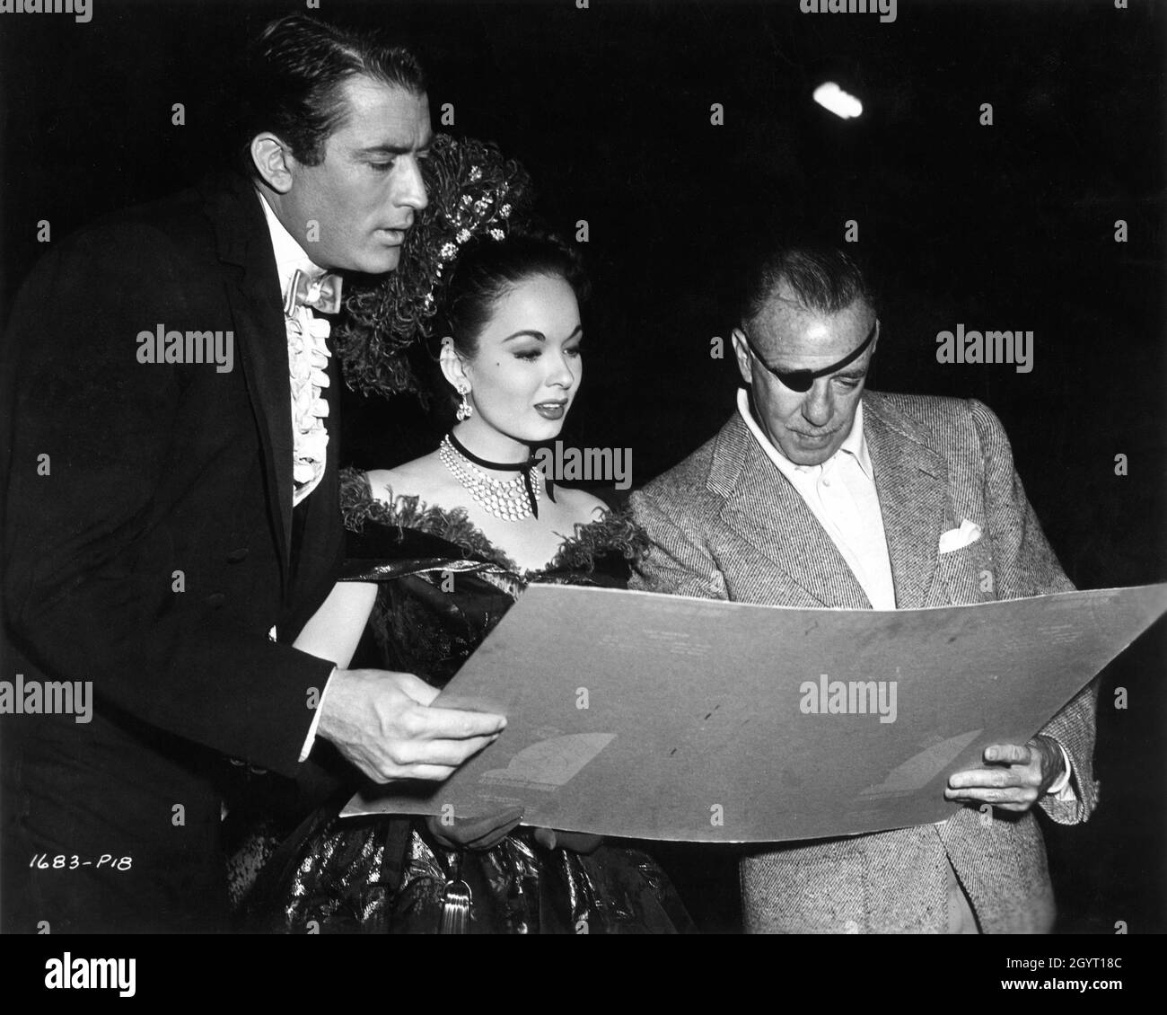 GREGORY PECK ANN BLYTH and Director RAOUL WALSH on set candid during ...