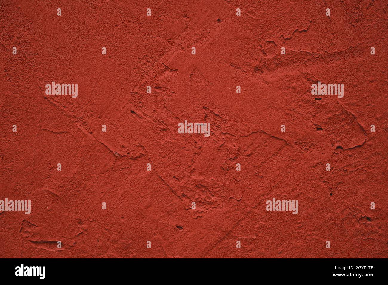 Red plaster finish wall texture detail Stock Photo - Alamy