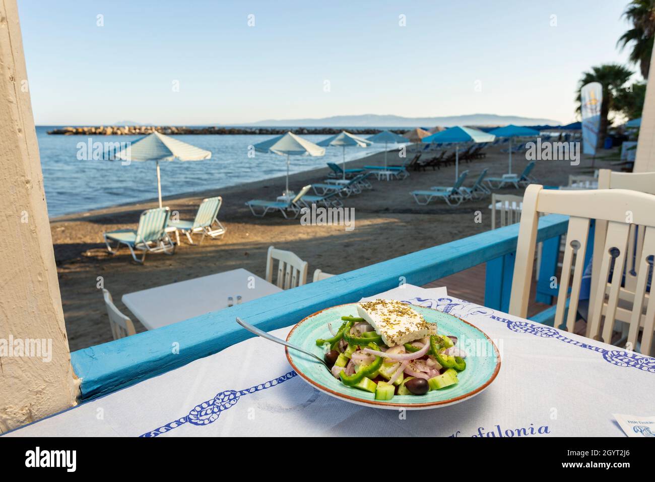 A greek salad on the table of a waterfront taverna in Katelios ...