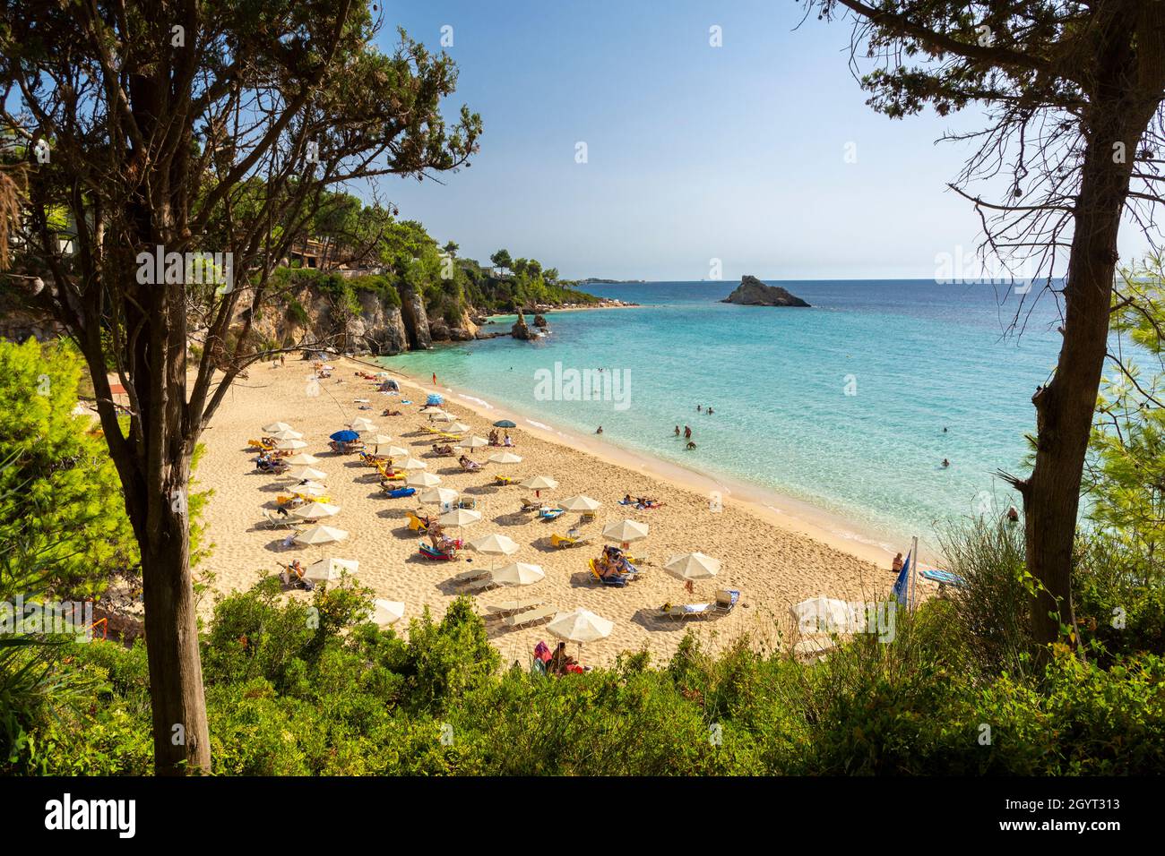 View of Platis Gialos Beach through trees, near Argostoli, Kefalonia ...