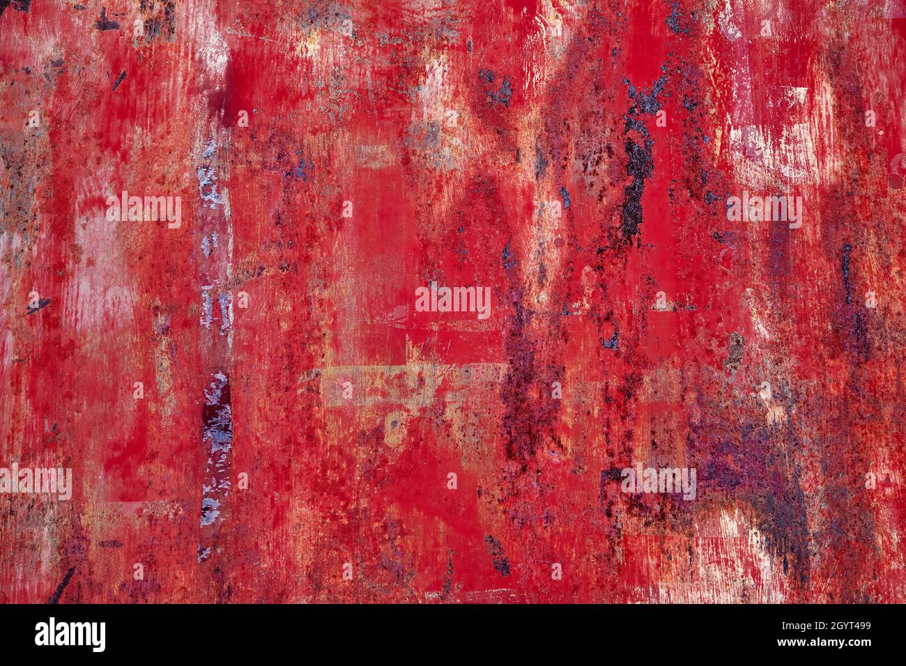Old corroded metal sheet with worn out red peeling paint, grunge ...