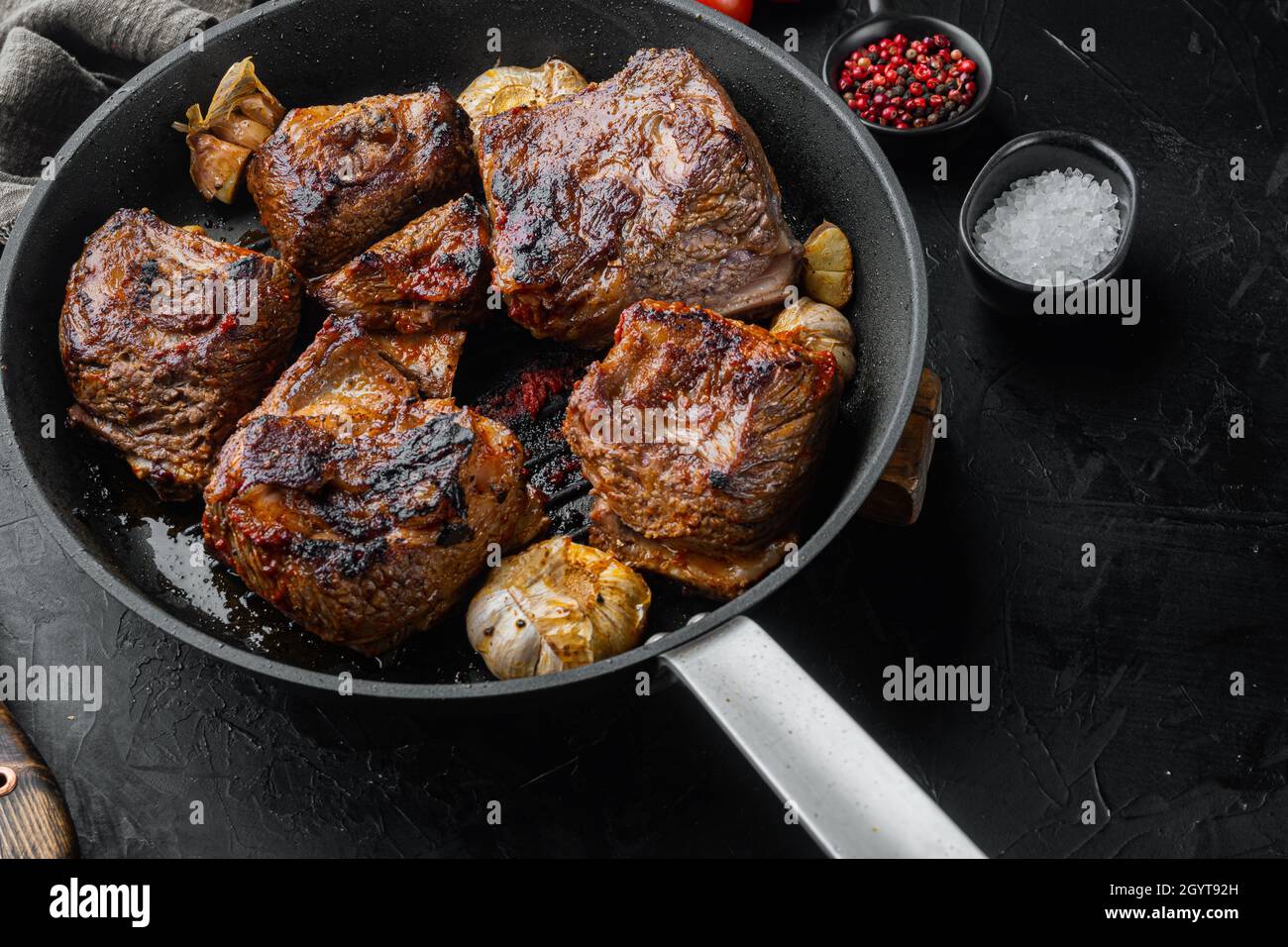 Homemade Braised Beef Short Ribs set, on black stone background Stock ...