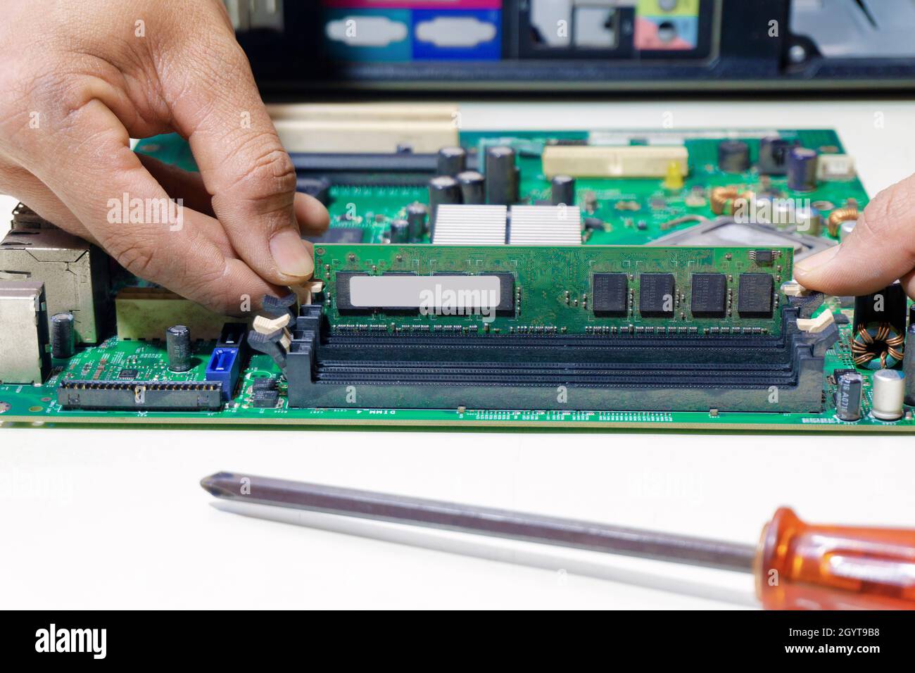 Hand of a technician fix and upgrade memory computer pc to repair ...