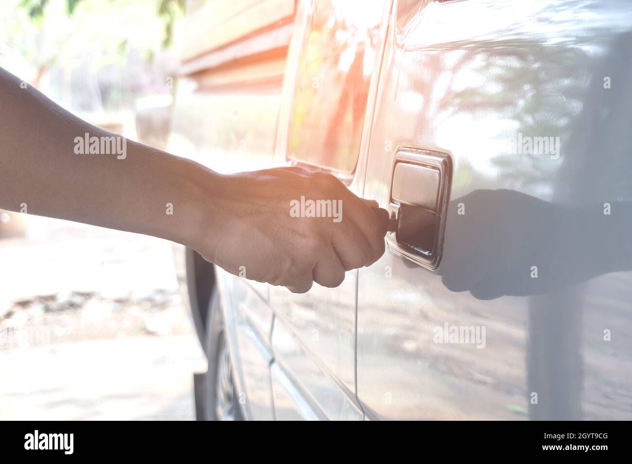 Normal Car key in men hand opening his car Stock Photo - Alamy