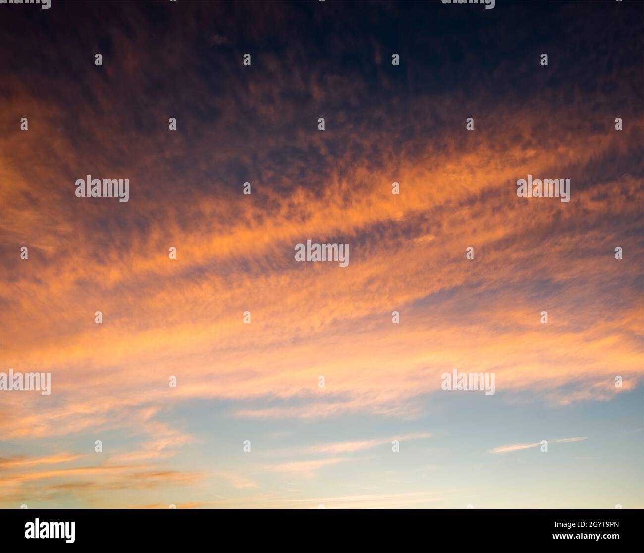 Colorful sunset sky with dramatic orange clouds. Only sky, no land ...