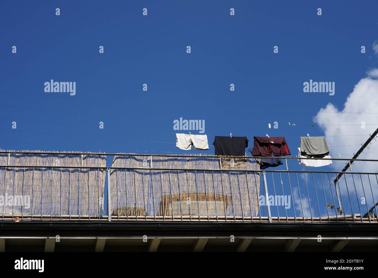 Hanging clothes on balcony hi-res stock photography and images - Alamy