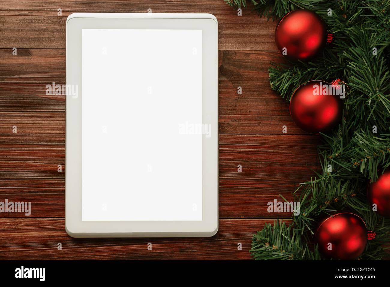 Merry christmas tablet computer mockup template with pine leaves ...