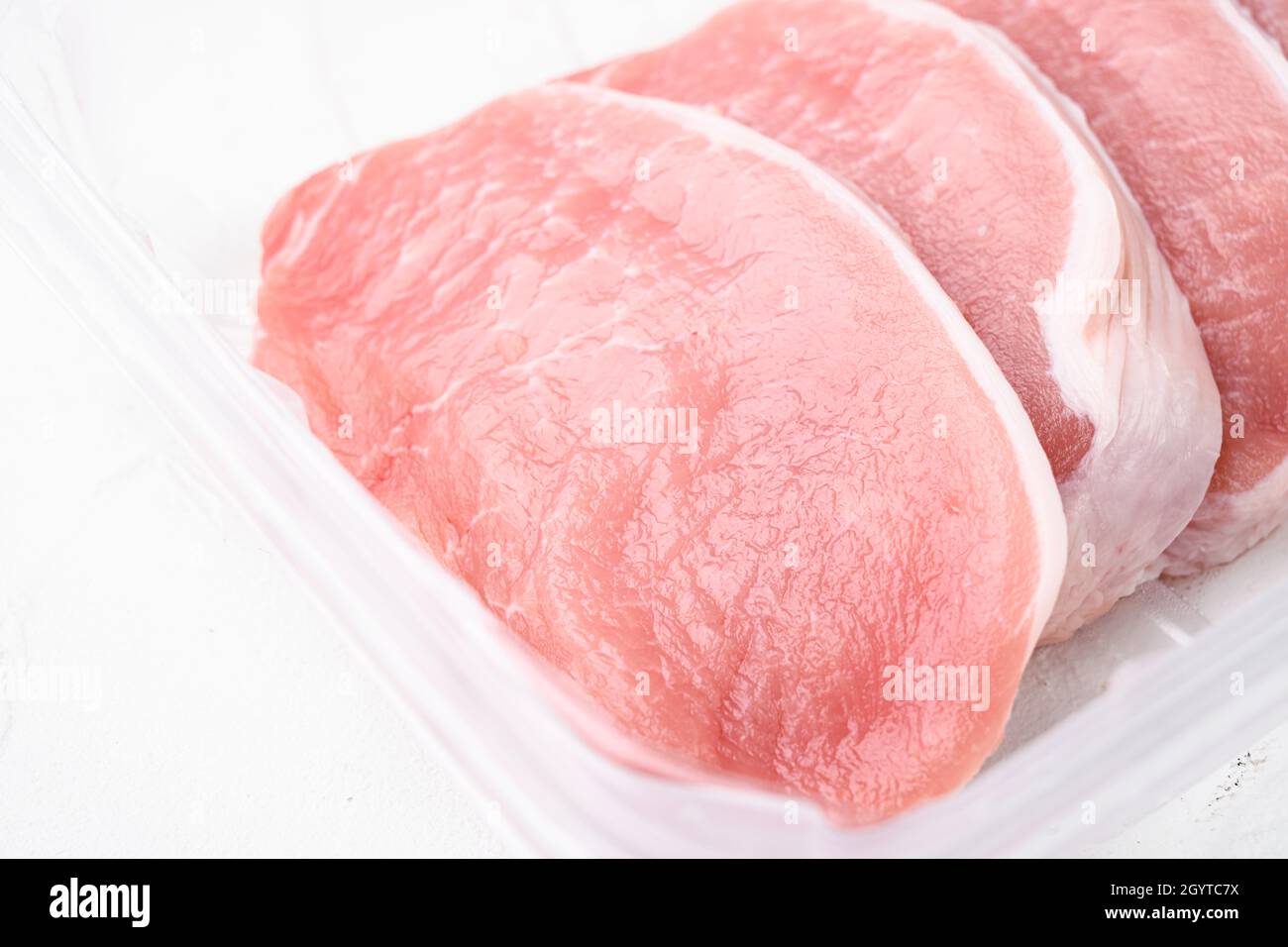 Pork chop sliced fresh meat set, in plastic pack container, on white ...