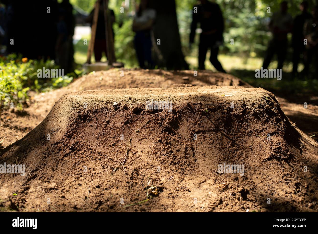 Woman standing grave in cemetery hi-res stock photography and images ...