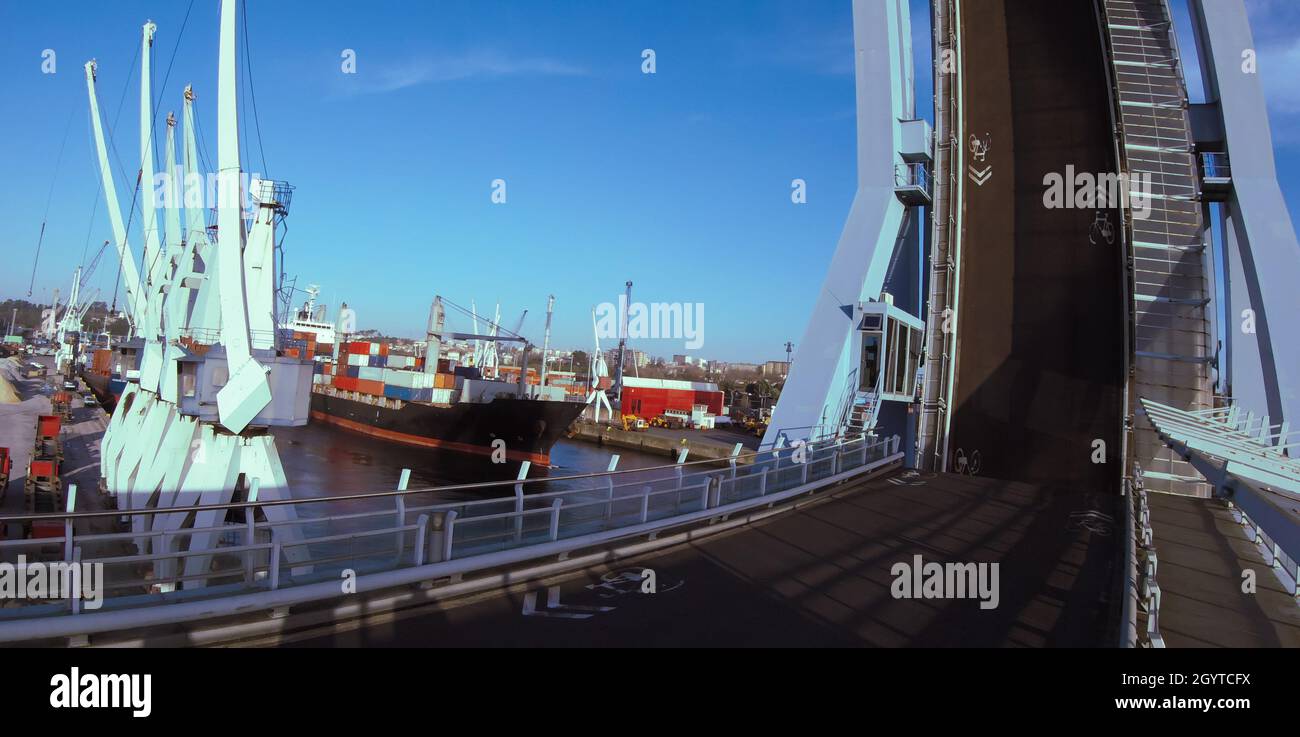 Photo of the bridge raised for the passage of a container ship on a ...
