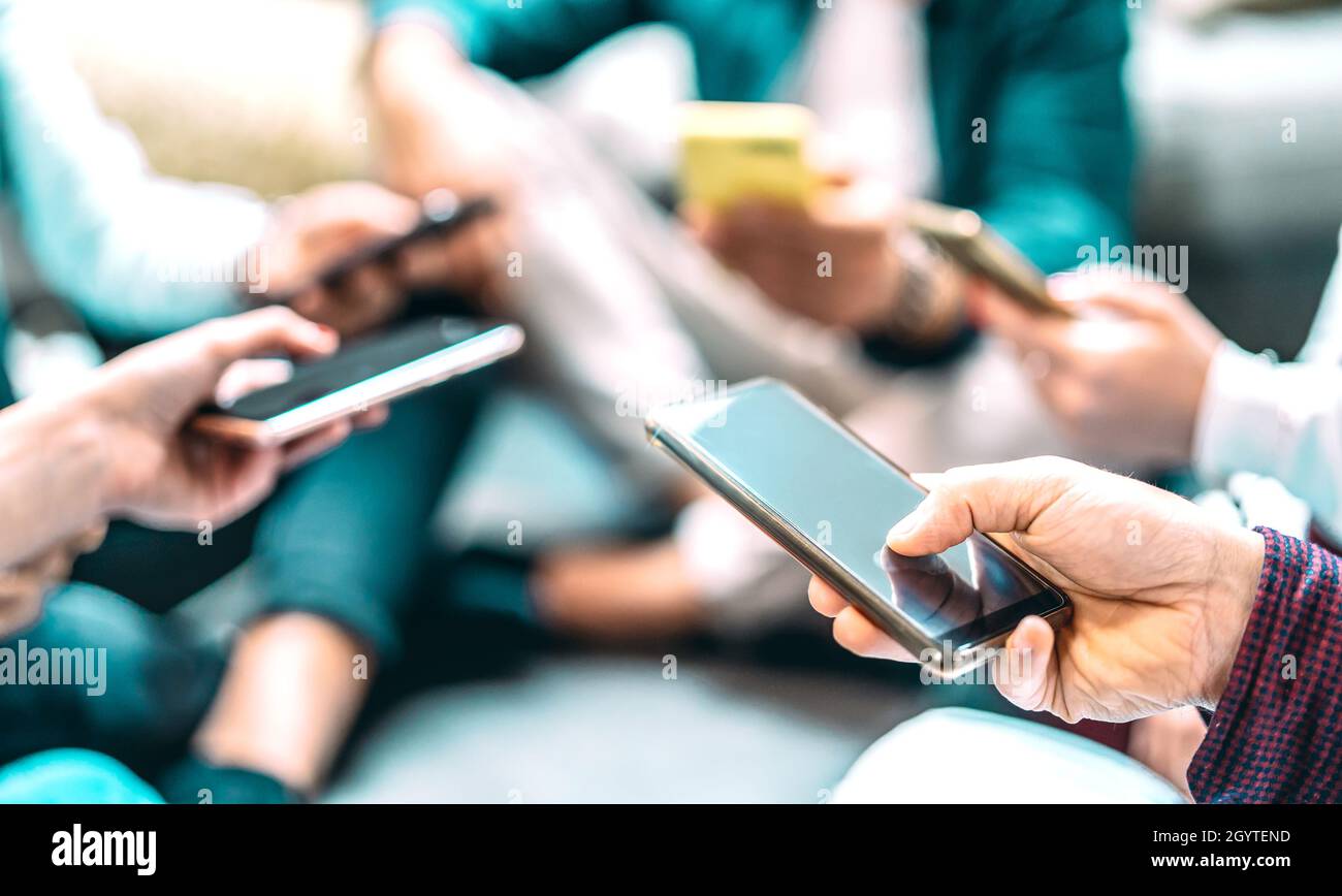 Close up of people using mobile smart phones - Detail of friends ...