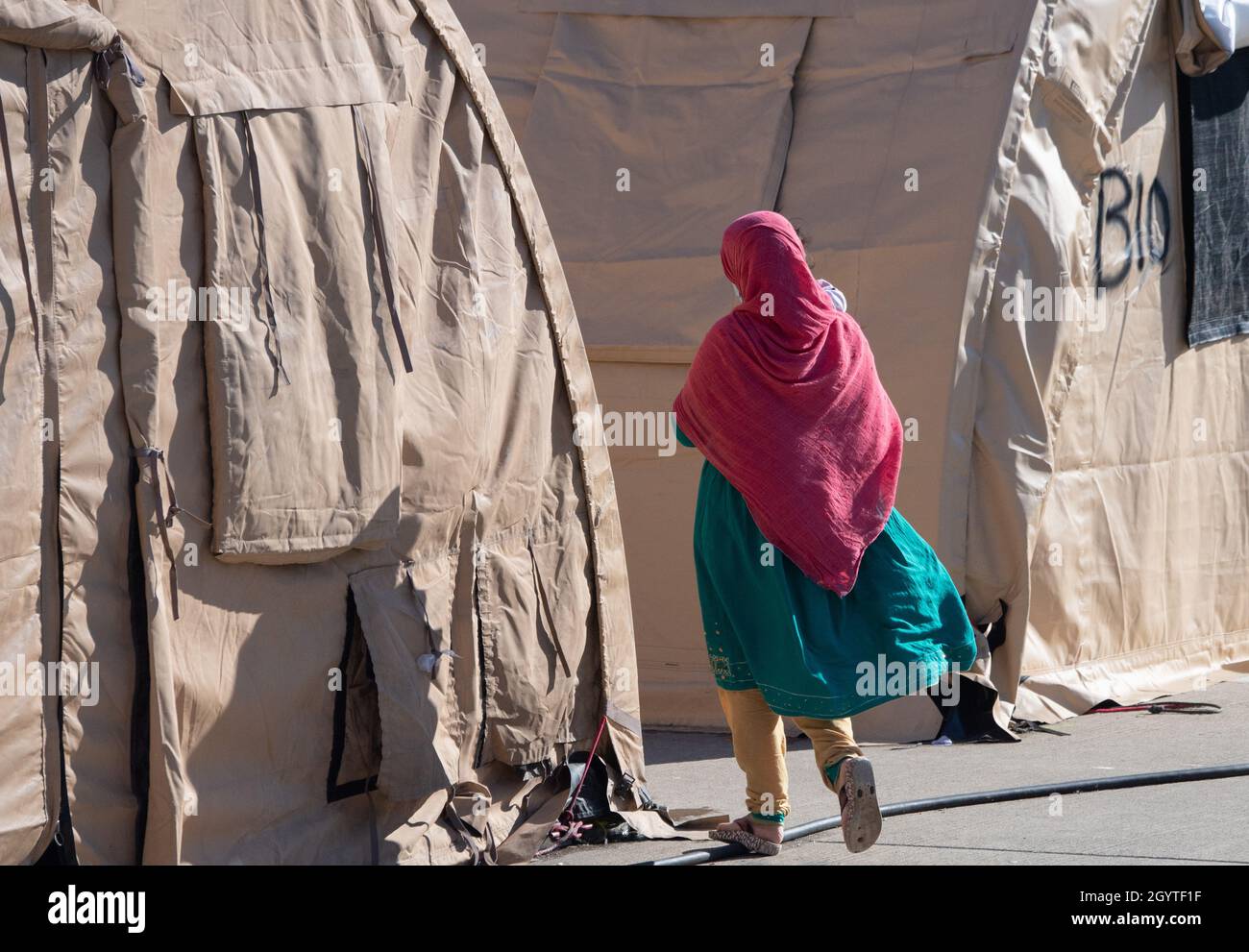 Ramstein, Germany. 09th Oct, 2021. An Afghan woman walks among refugee ...