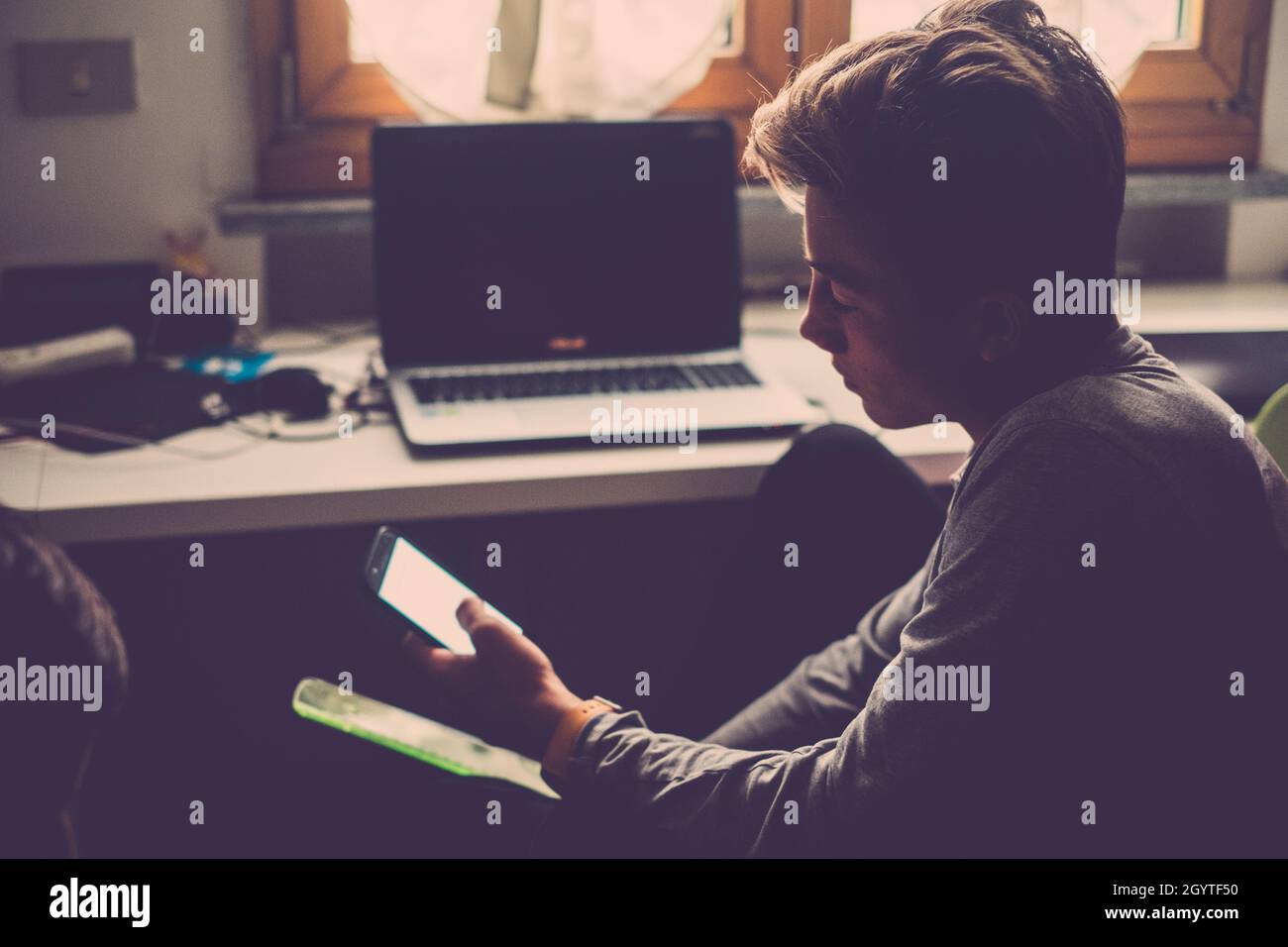 Teenage boy computer games laptop home hi-res stock photography and ...