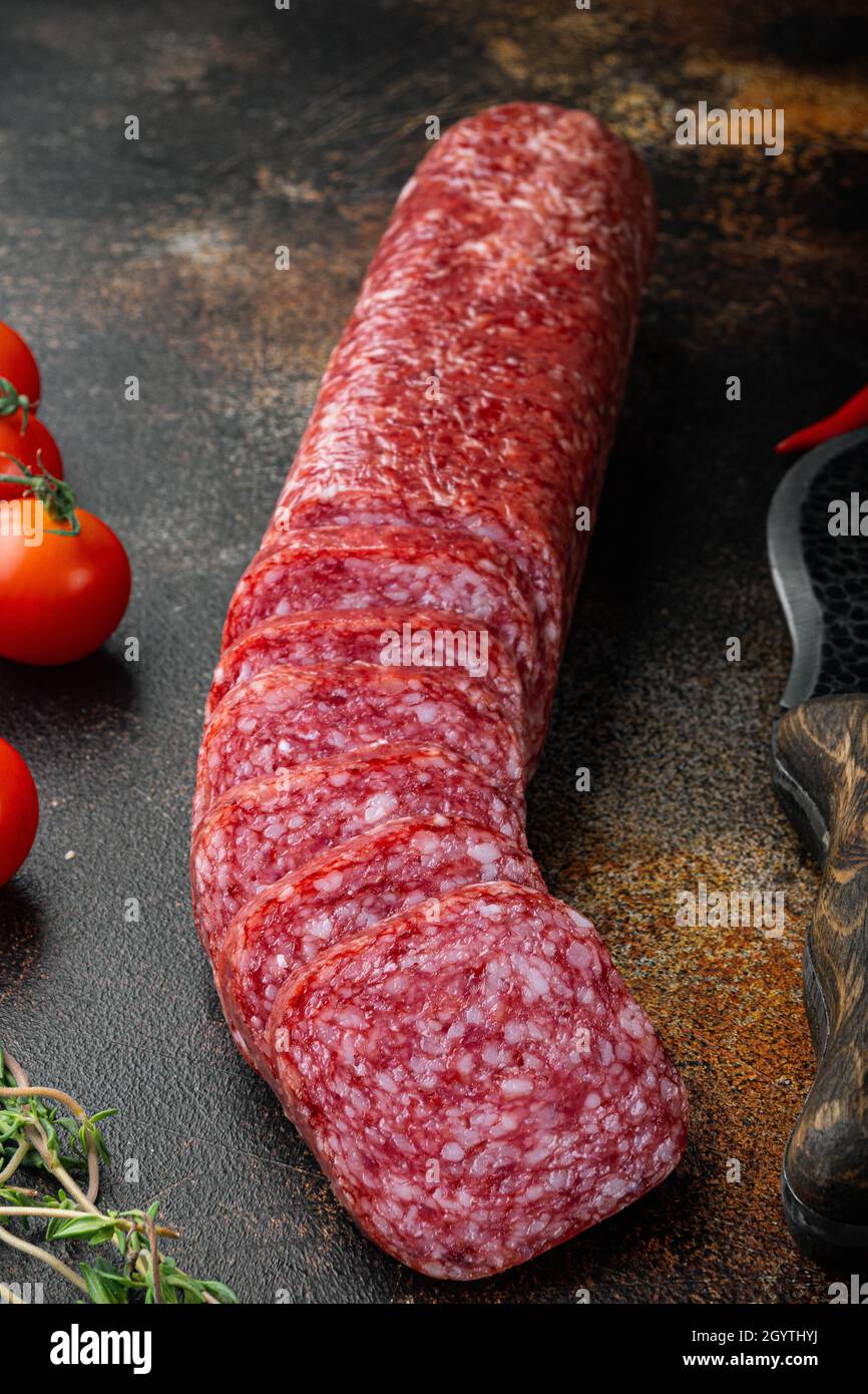 Sliced salami set, on old dark rustic table background Stock Photo - Alamy