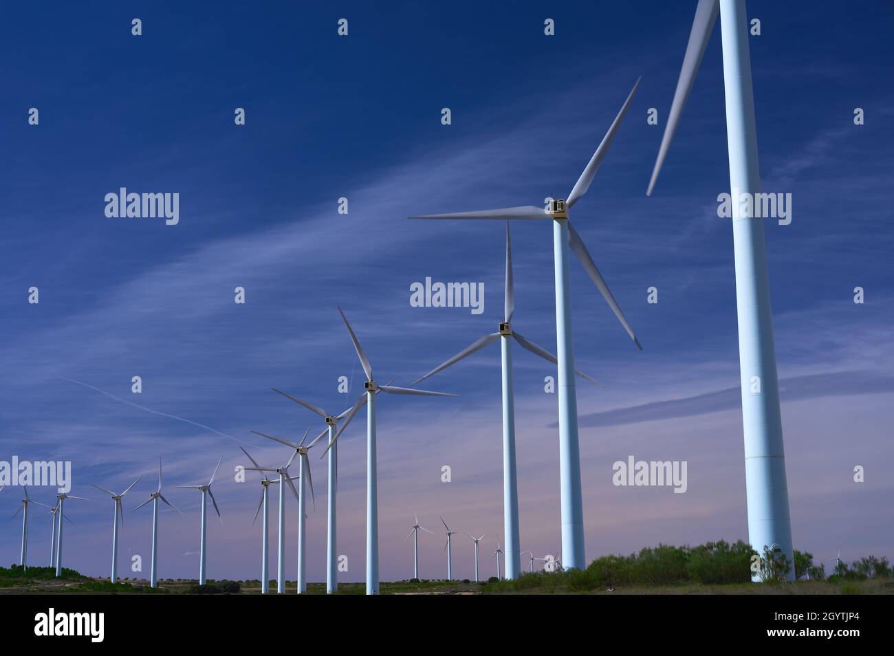 detail of a modern windmill farm with blue skies Stock Photo - Alamy