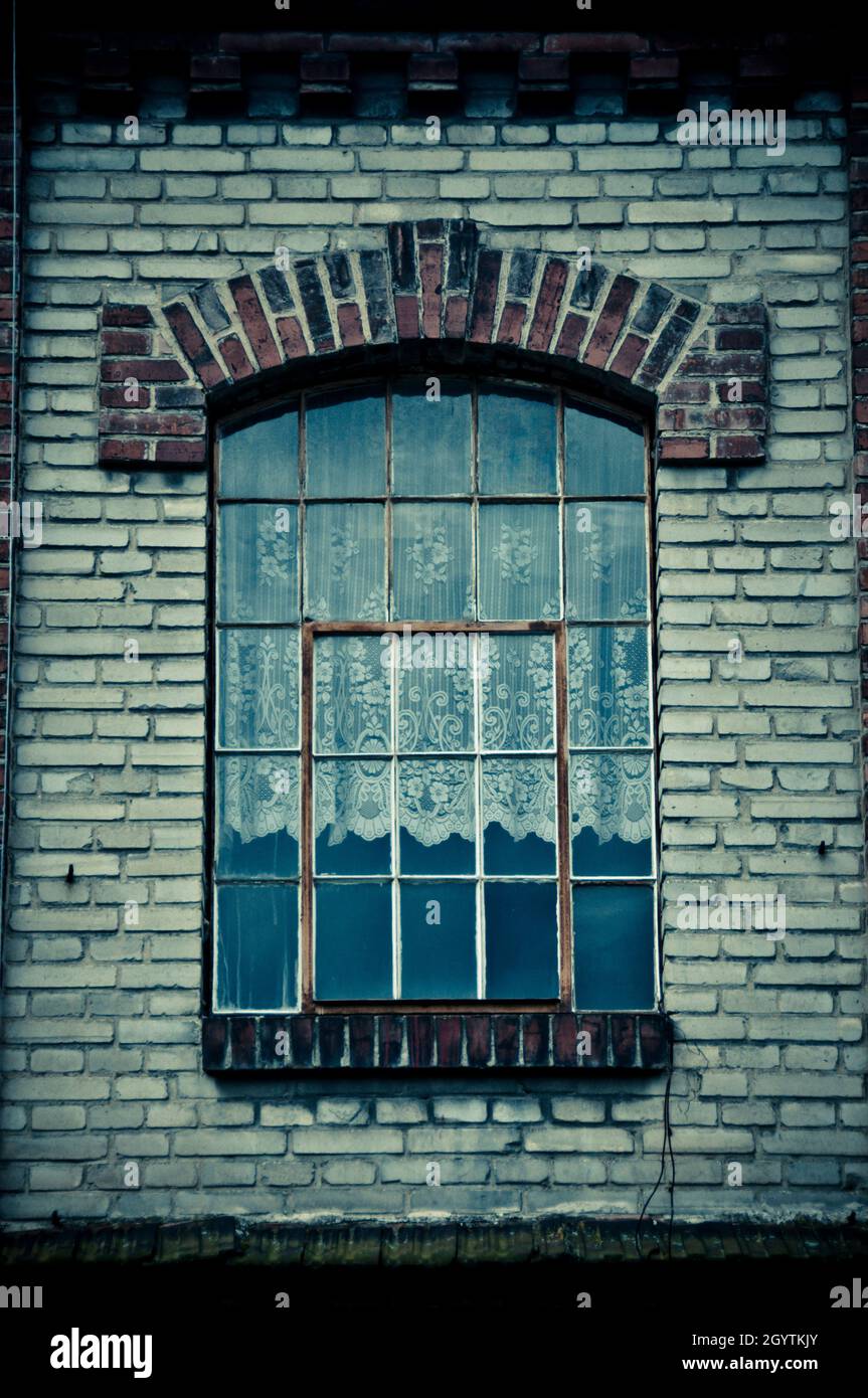 mysterious window of an old brown bricks house Stock Photo - Alamy