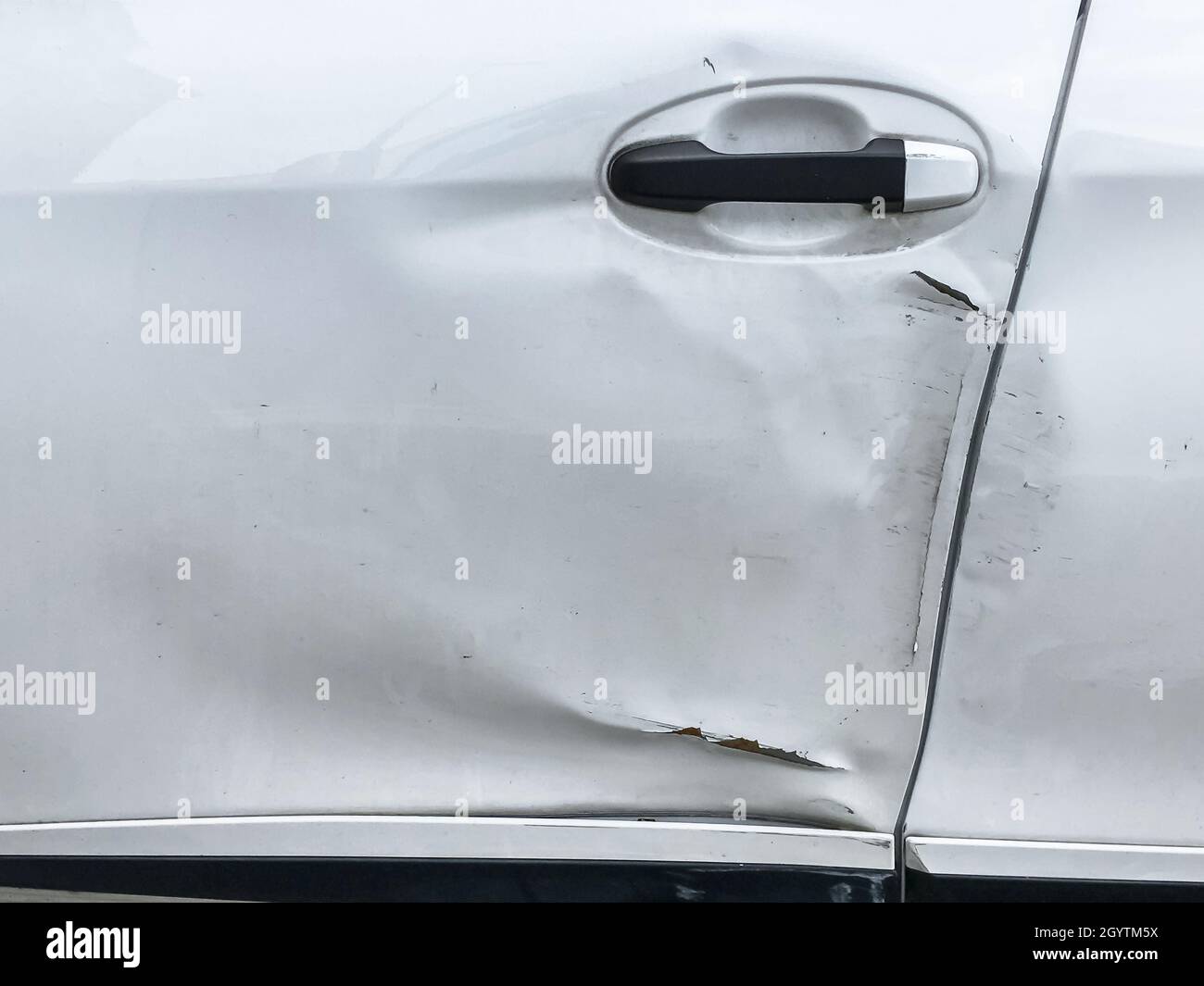 Dents on the car door caused by the accident. scratched car body Stock ...