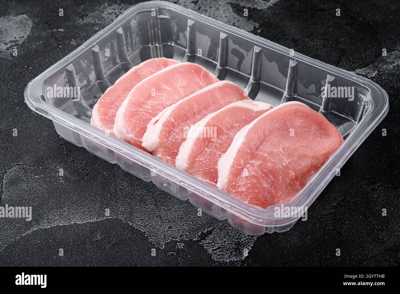 Raw organic meat. Pork steaks, fillets for grilling, baking or frying ...