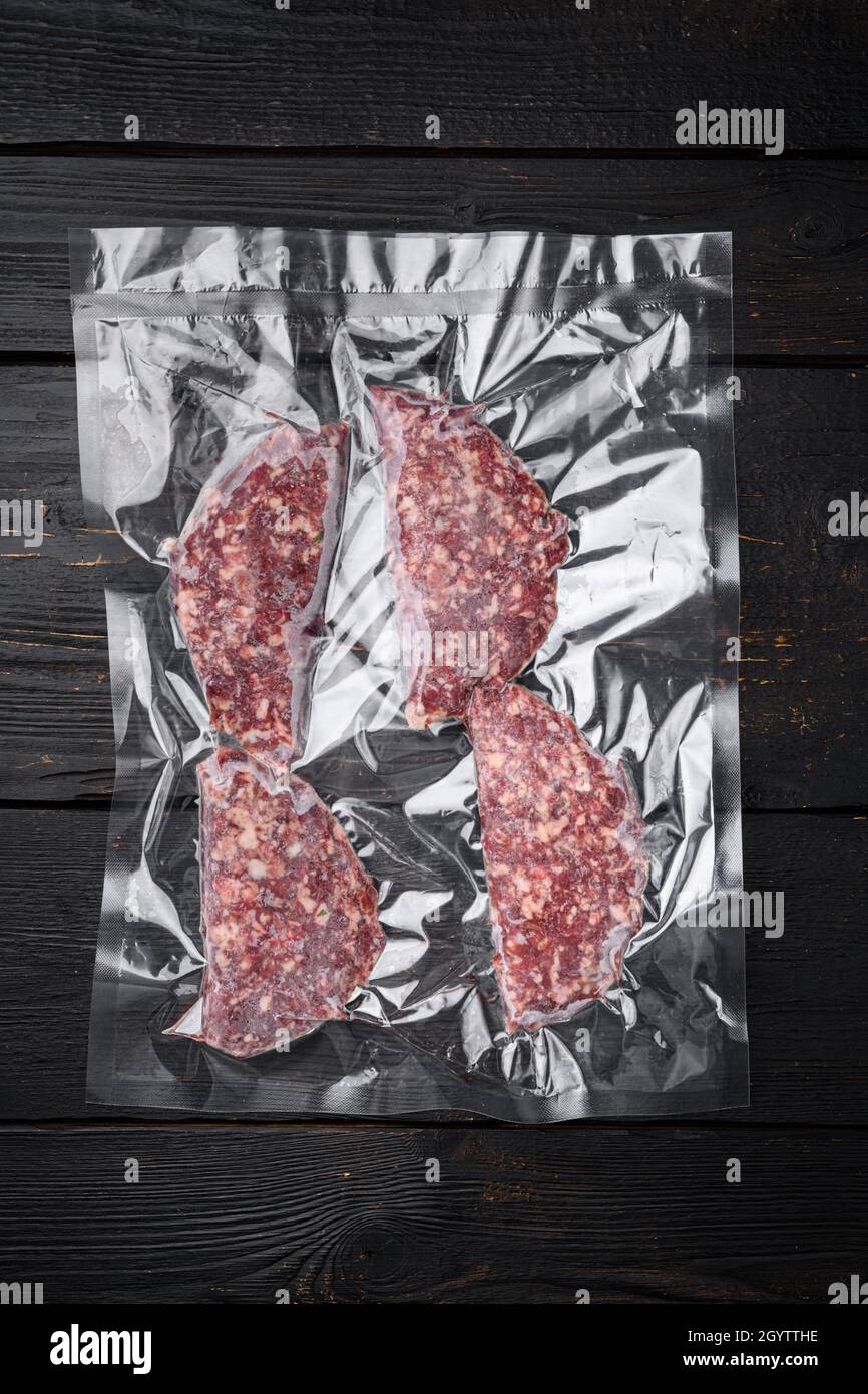 Vacuum beef or lamb mutton cutlet sealed airtight pack set, on black ...