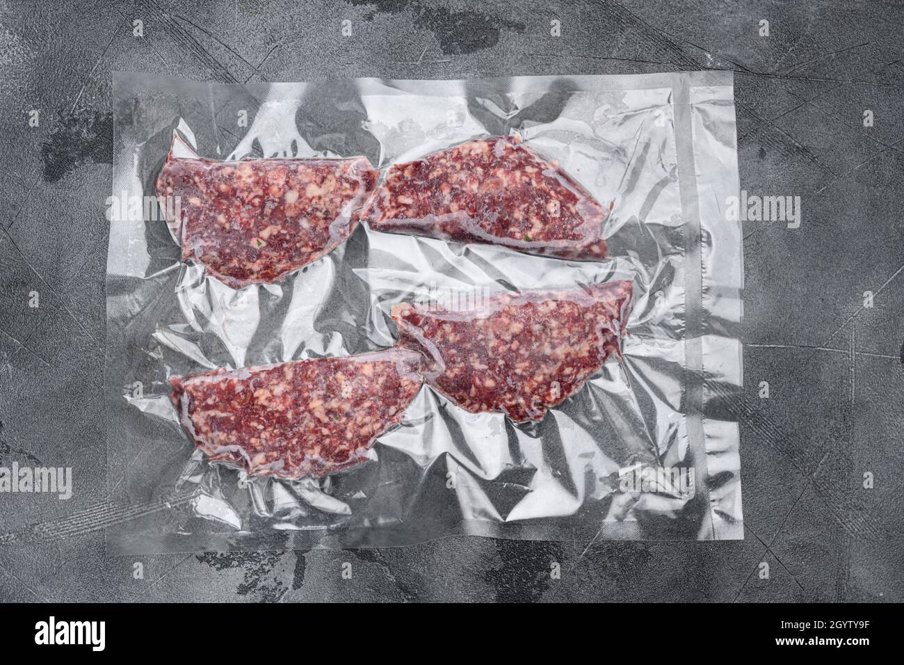 Vacuum beef or lamb mutton cutlet sealed airtight pack set, on gray ...