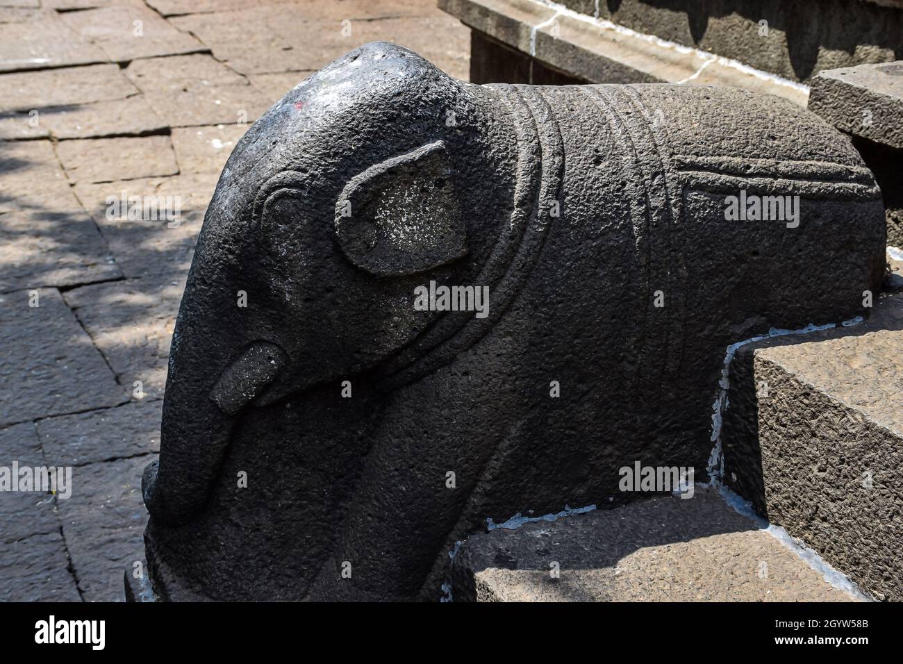 Ancient carved elephant statue in an old Hindu temple at Kolhapur ...
