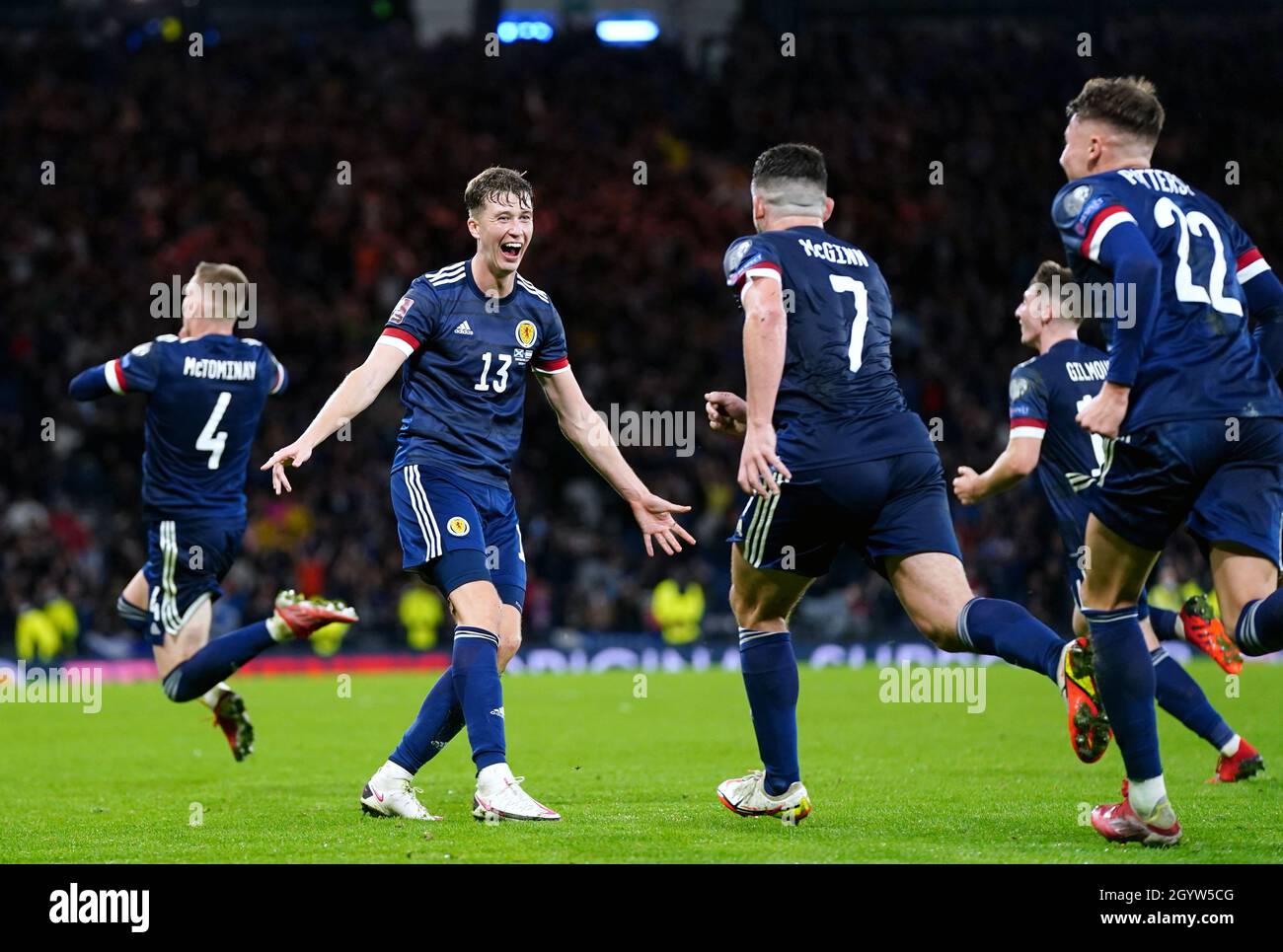Scotland's Jack Hendry (second left) celebrates after assisting team ...